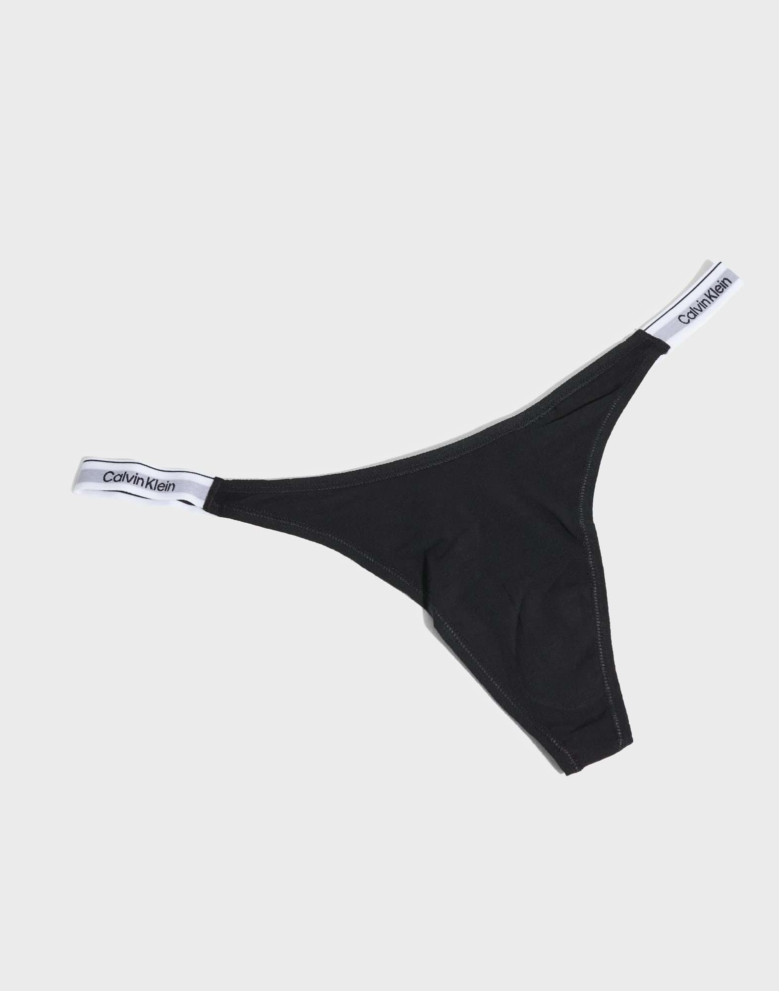 Osta Calvin Klein Underwear STRING THONG (DIPPED) - Black | Nelly.com