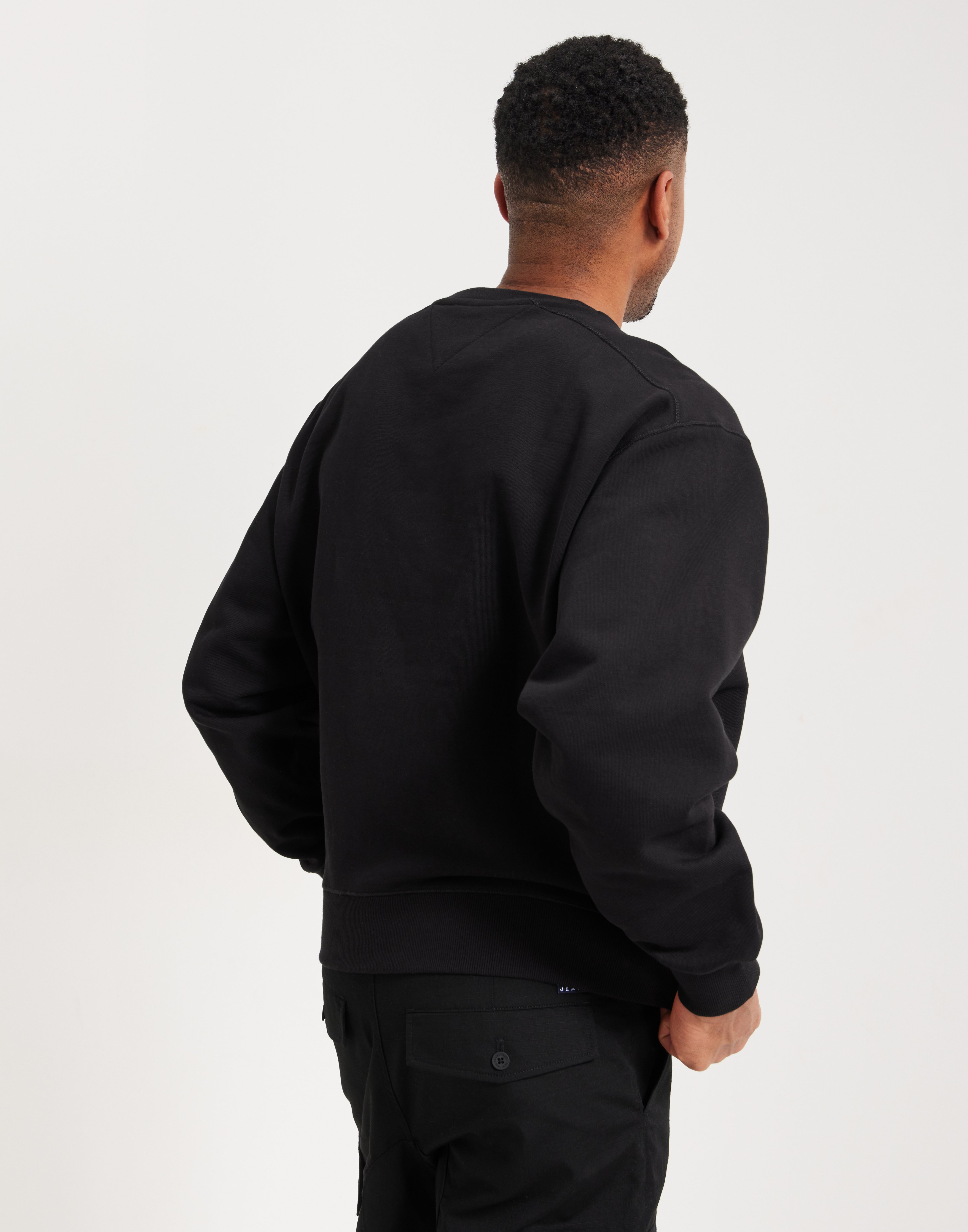 Kjøp Tommy Jeans TJM BOXY MODERN SPORT USA CREW - Black | NLYMAN