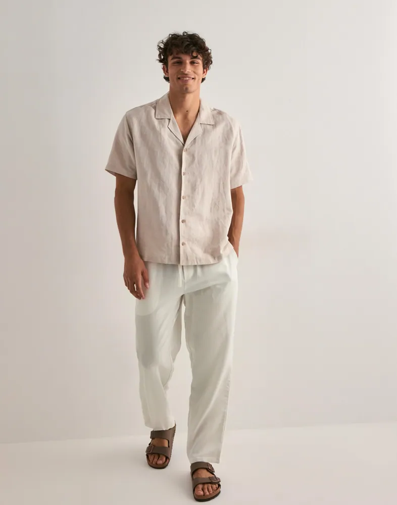 Kjøp Brand Island CARTER PANTS - Offwhite | NLYMAN