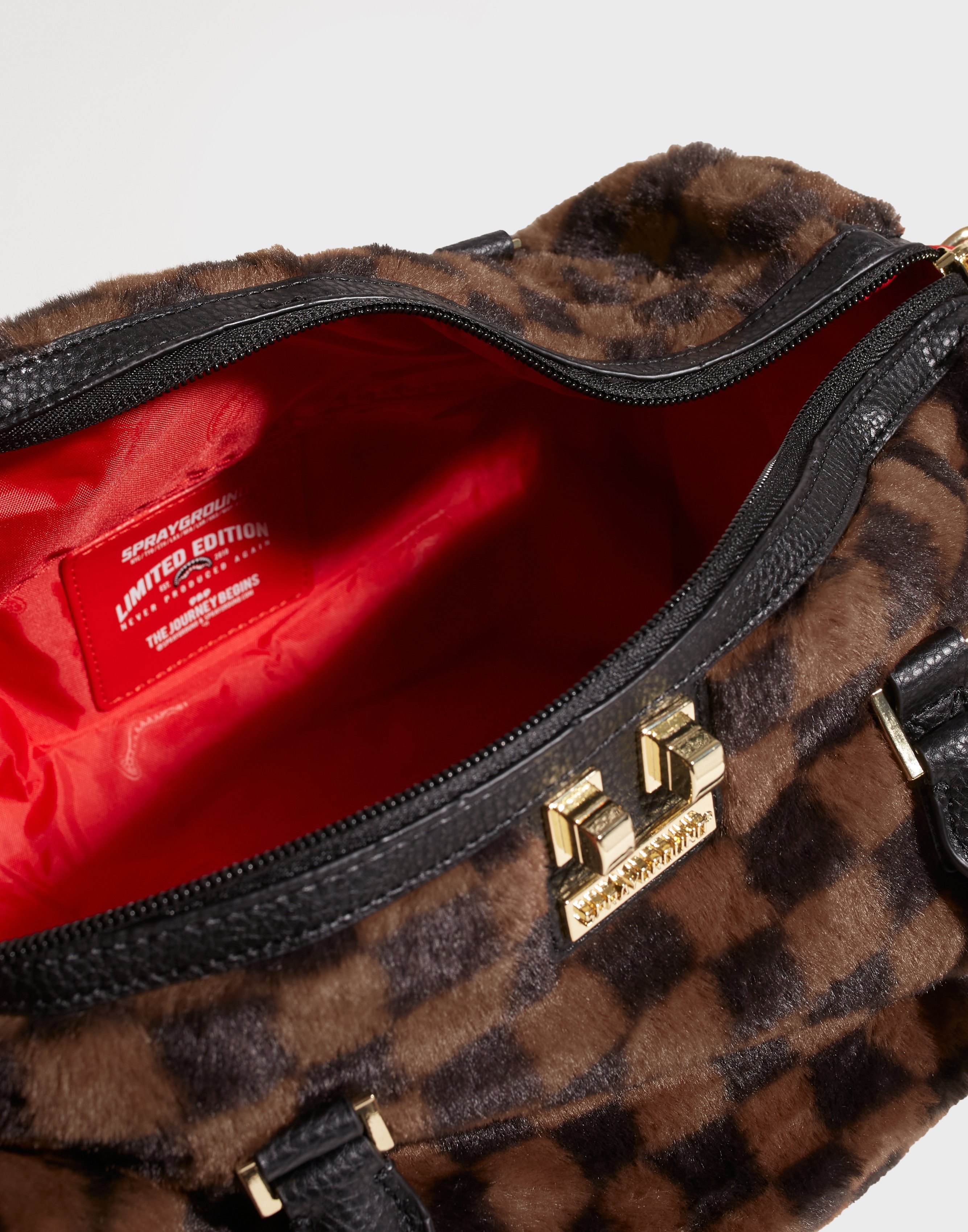 Buy Sprayground FUR SHARKS IN PARIS MINI DUFFLE - Black | NLYMAN