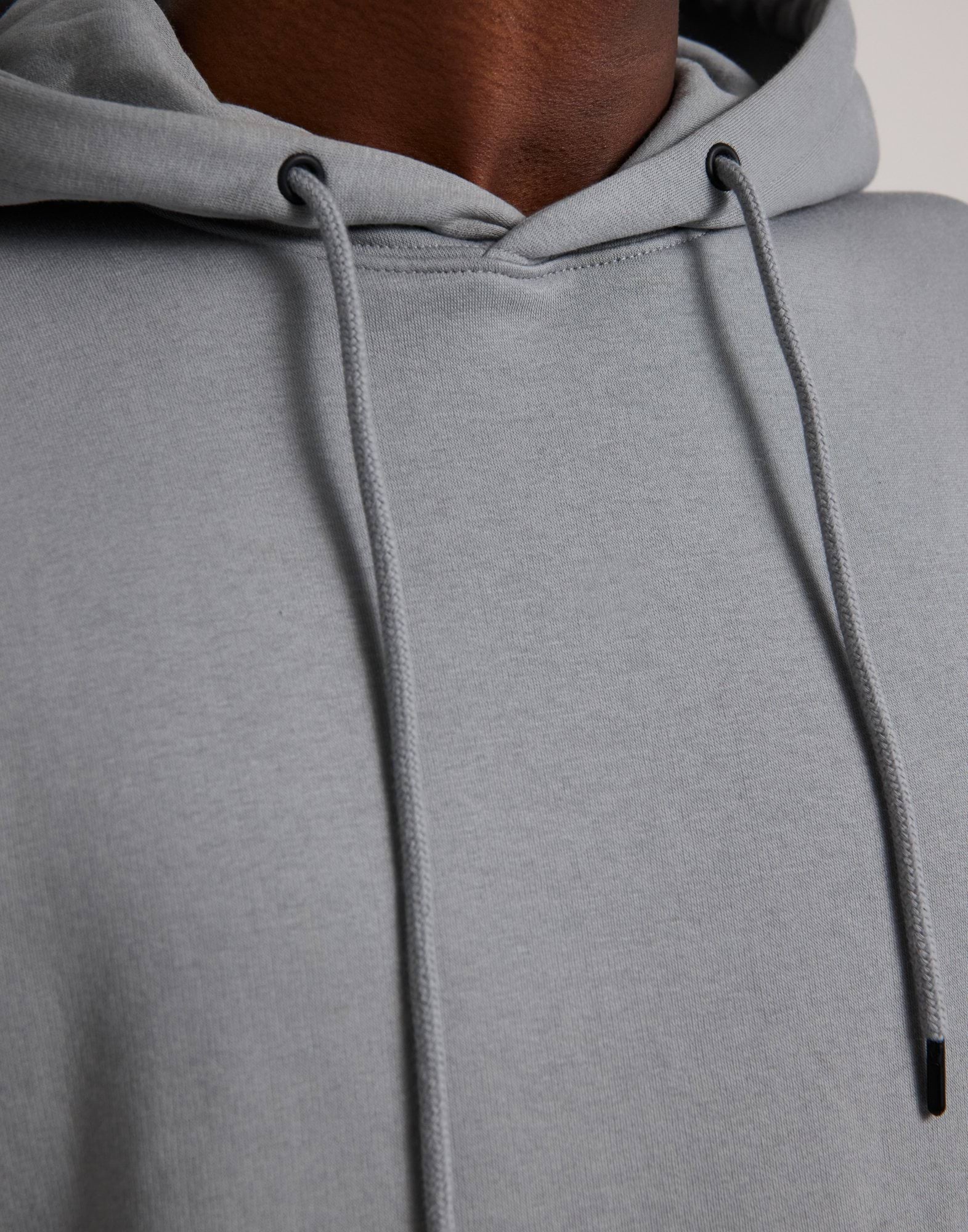 Köp Jack & Jones JJESTAR BASIC SWEAT HOOD NOOS - Ultimate Grey | NLYMAN