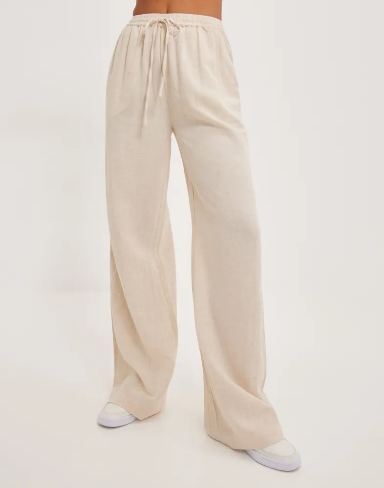 Köp Nelly Flowy Drawstring Linen Pants - Beige | Nelly.com